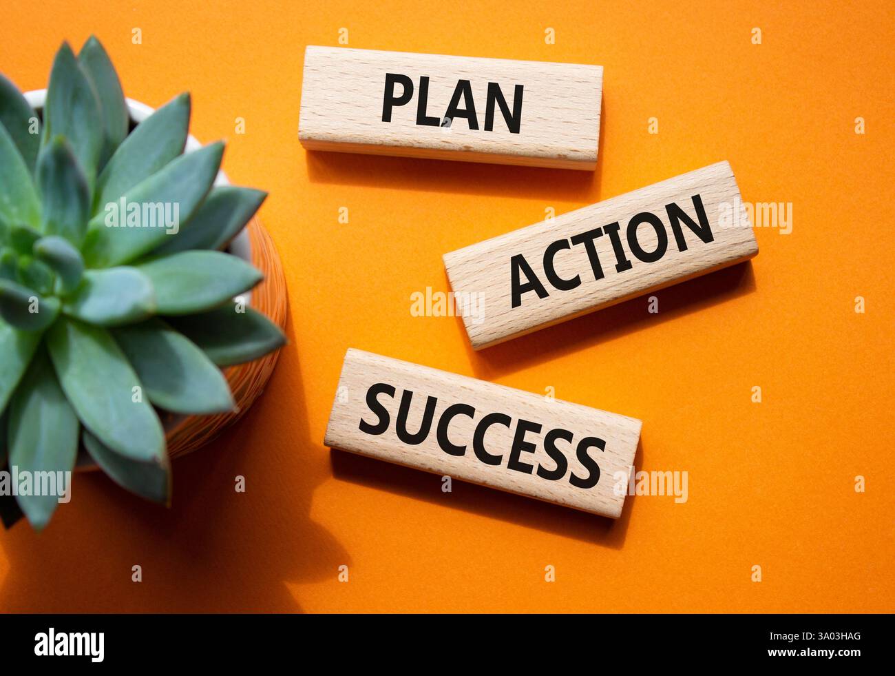 Plan Action Success symbol. Concept word Plan Action Success on wooden blocks. Beautiful orange ...