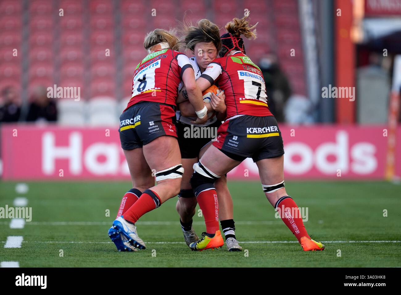 Bristol Bears' Alisha Joyce-Butchers (centre) is tackled by Gloucester ...
