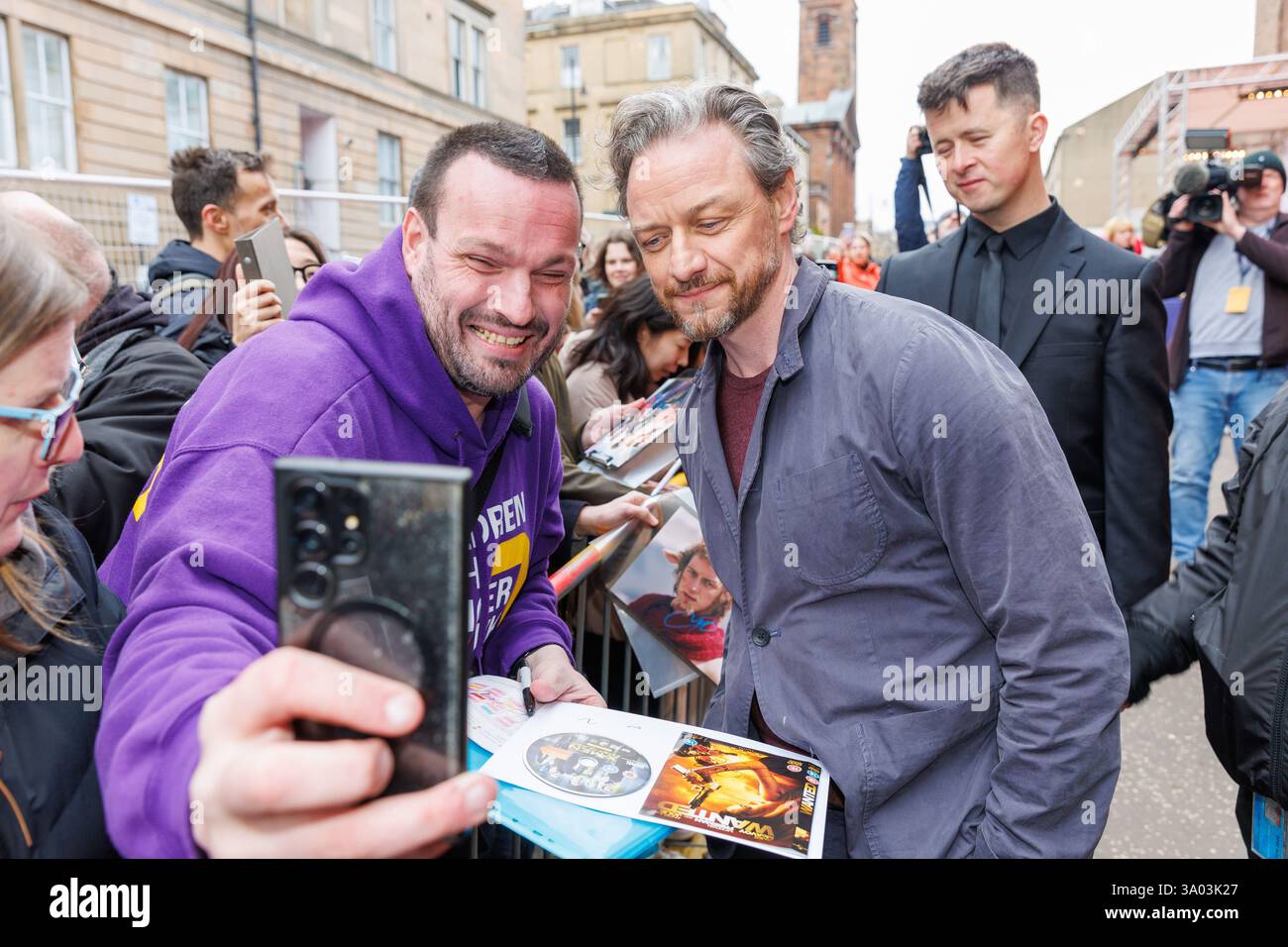 James McAvoy having a selfie taken with fans as he arrives at the ...