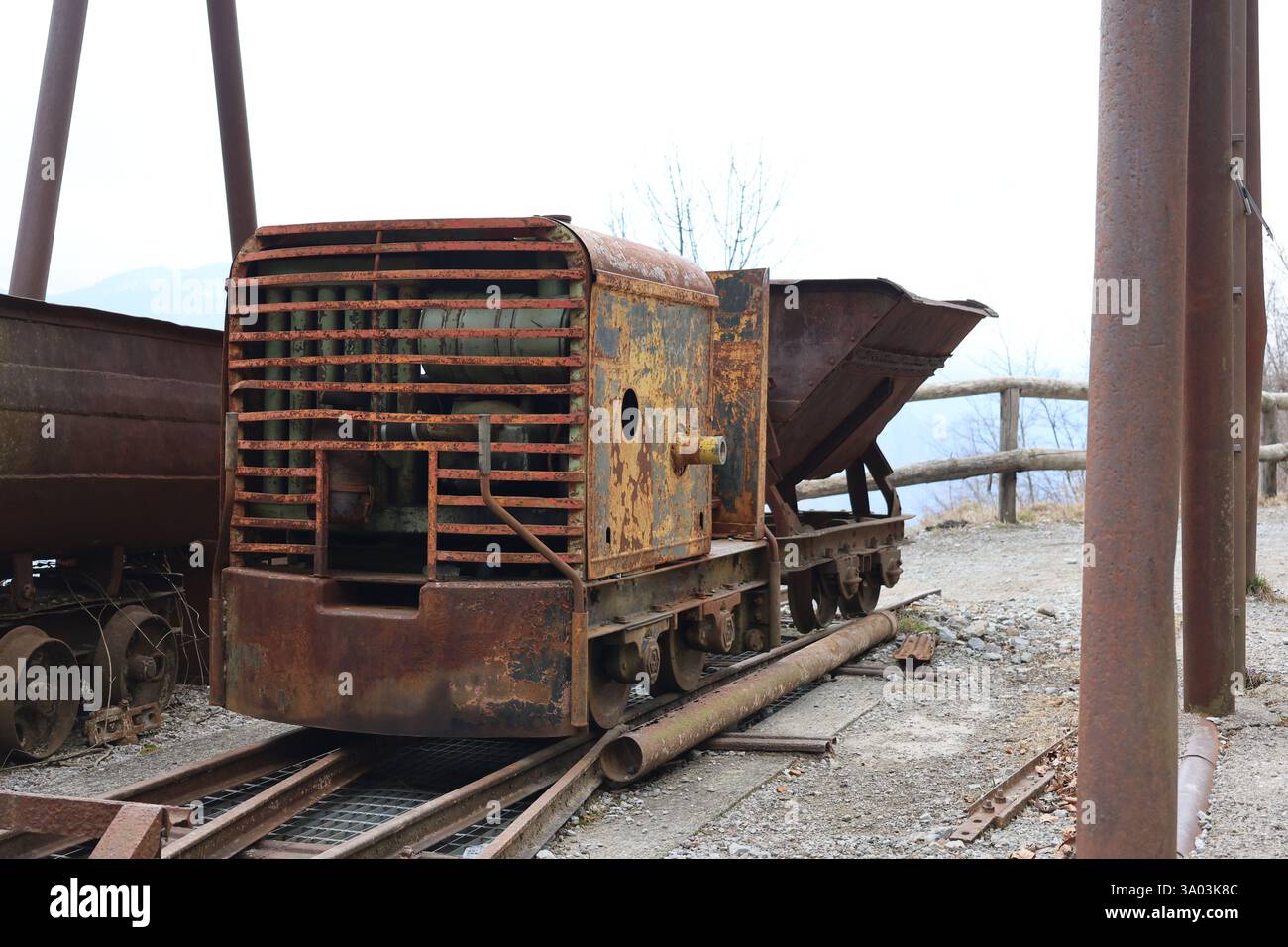 Rusty and abandoned mine train carrying a mine cart, Dossena mines ...