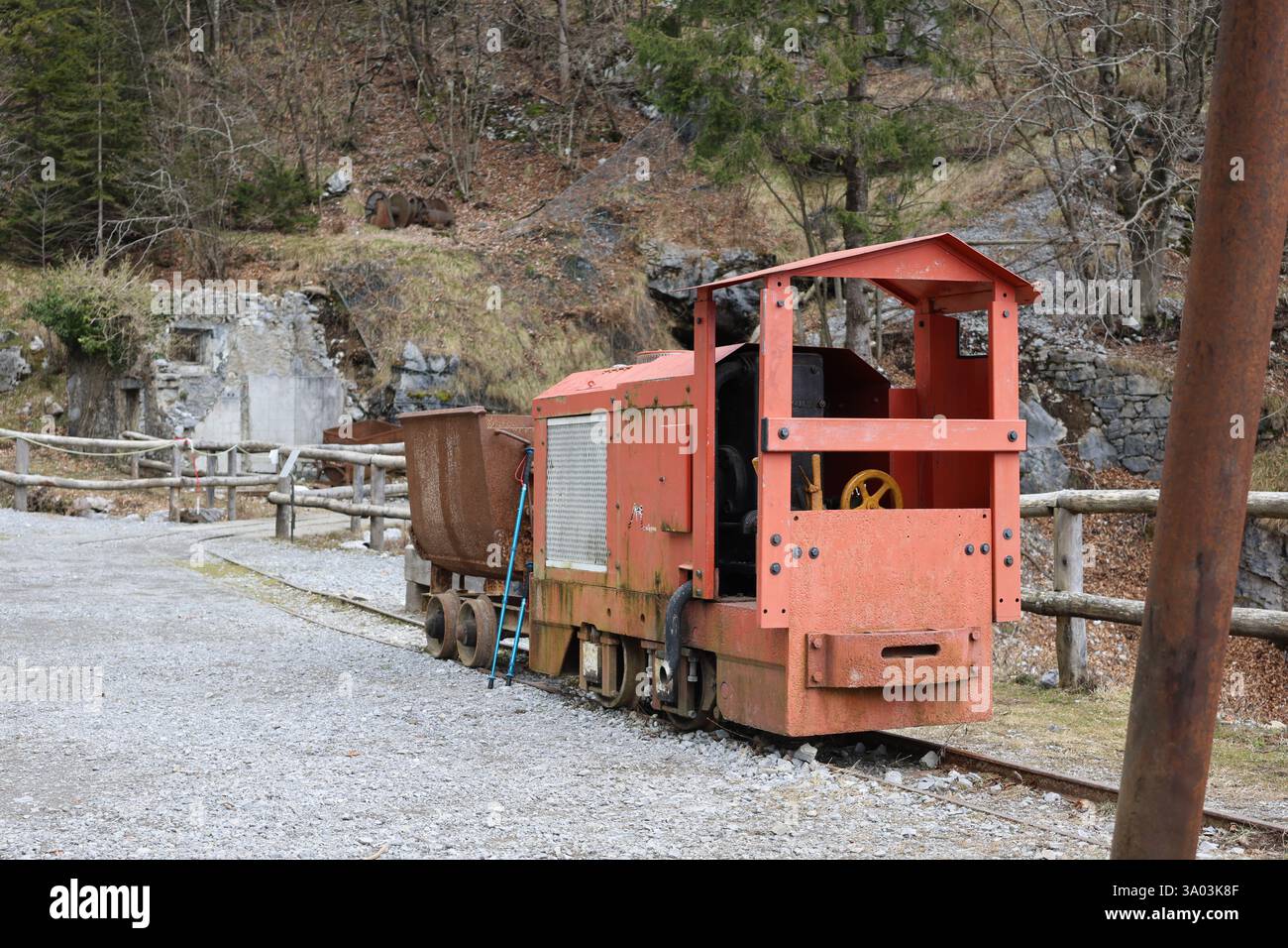 Rusty and abandoned mine train carrying a mine cart, Dossena mines ...