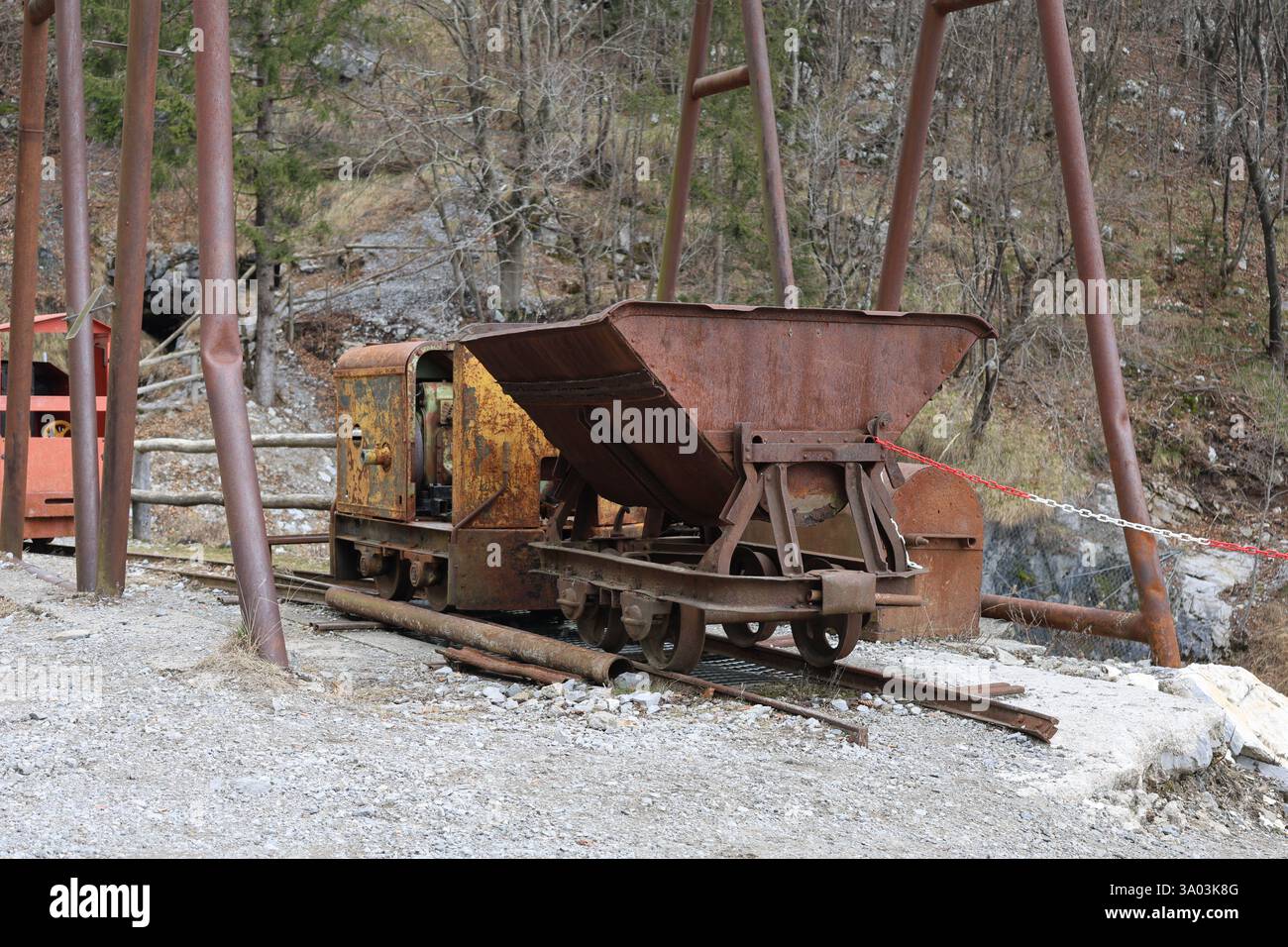Rusty and abandoned mine train carrying a mine cart, Dossena mines ...