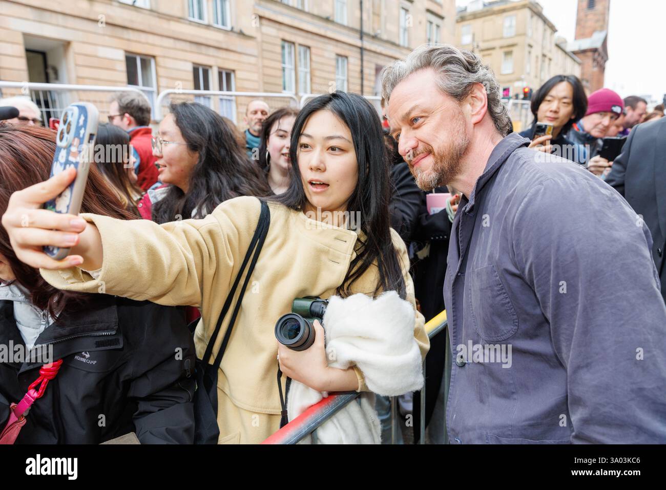 James McAvoy having a selfie taken with fans as he arrives at the ...
