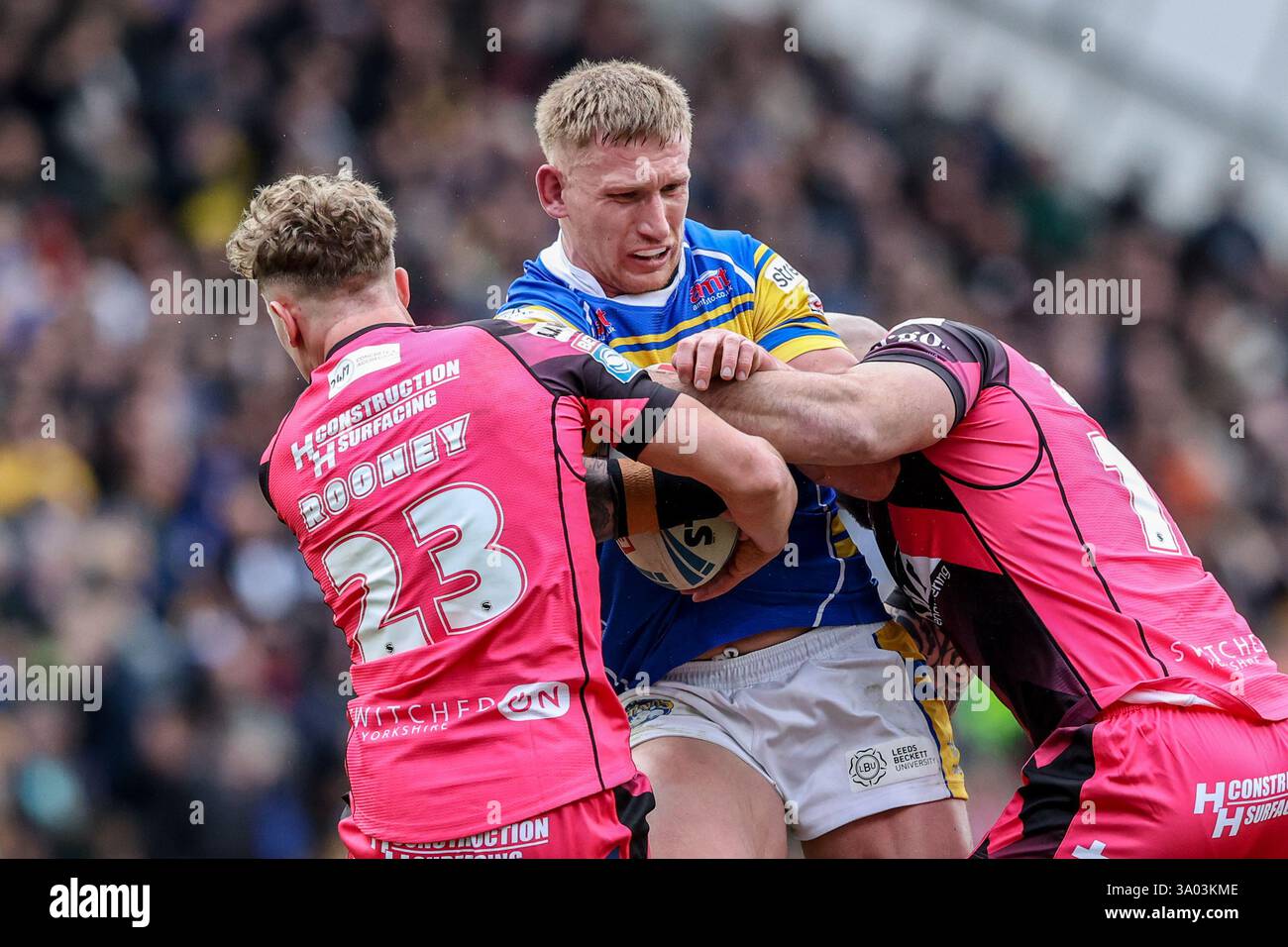 Leeds, UK. 02nd Mar, 2025. Mikolaj Oledzki of Leeds Rhinos is tackled ...