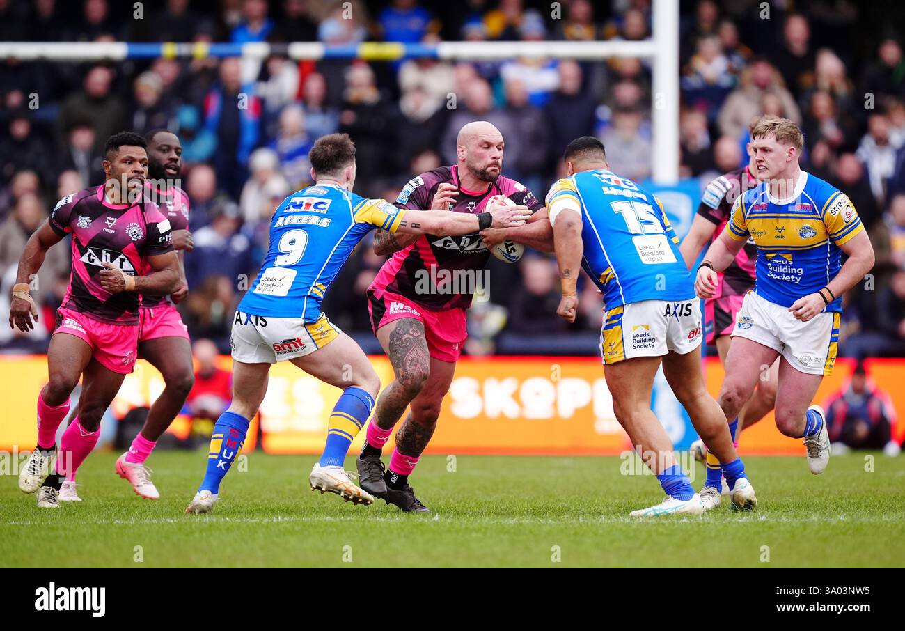 Castleford Tigers' George Griffin (centre) is tackled by Leeds Rhinos' Andy Ackers (centre left ...