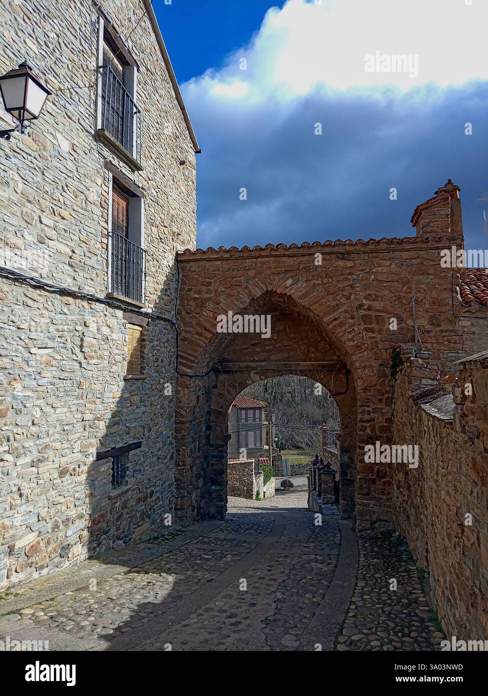 Ancient stone gate known as the River Gate in Yanguas, Soria, with ...