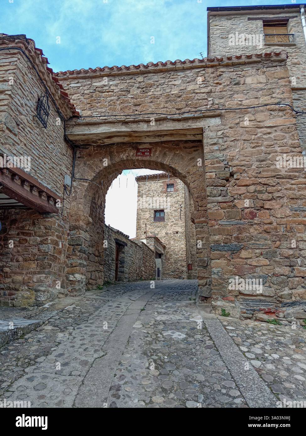 Ancient stone gate known as the River Gate in Yanguas, Soria, with ...