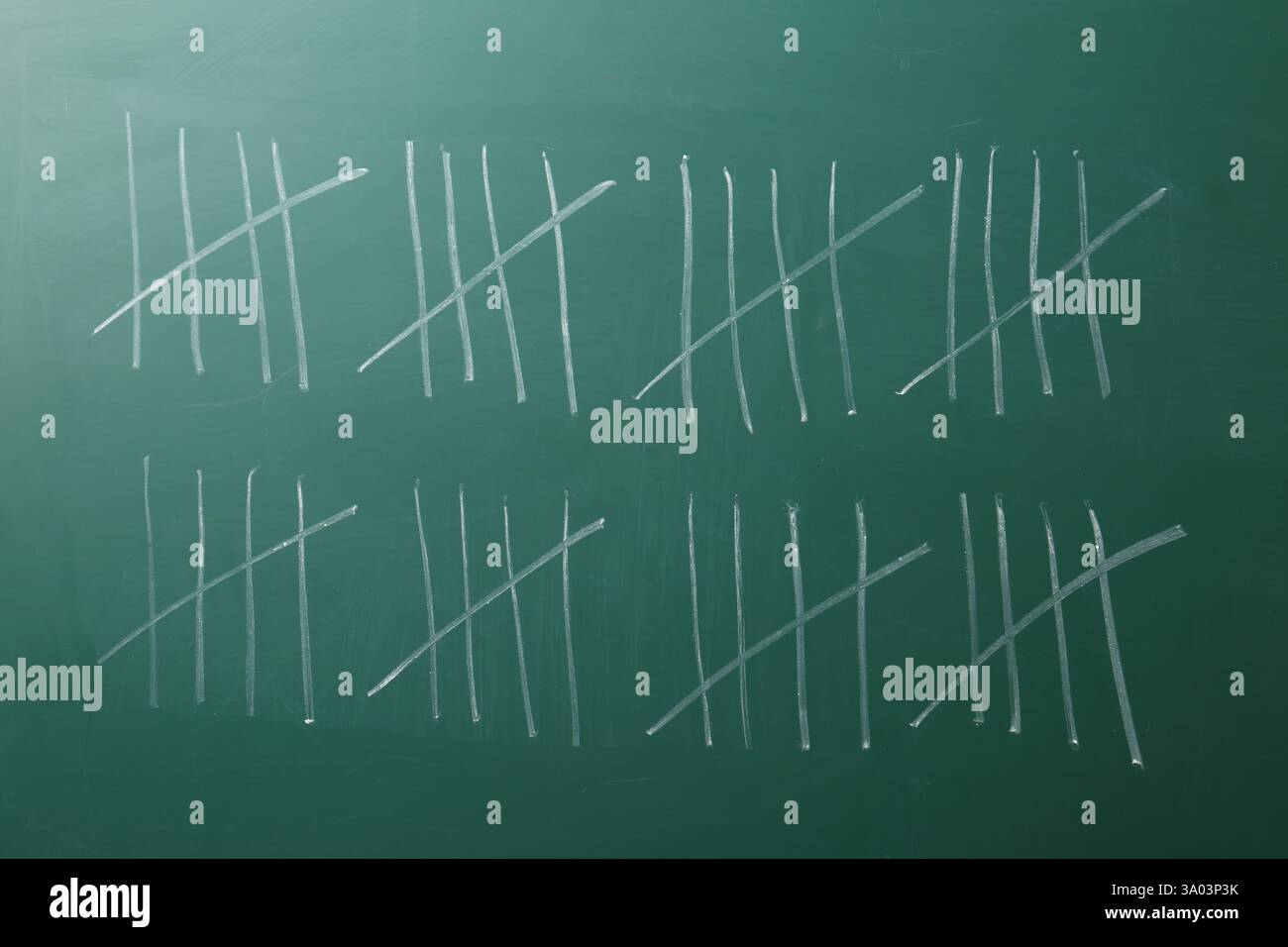 Counting days by drawing sticks with chalk on chalkboard, closeup Stock ...