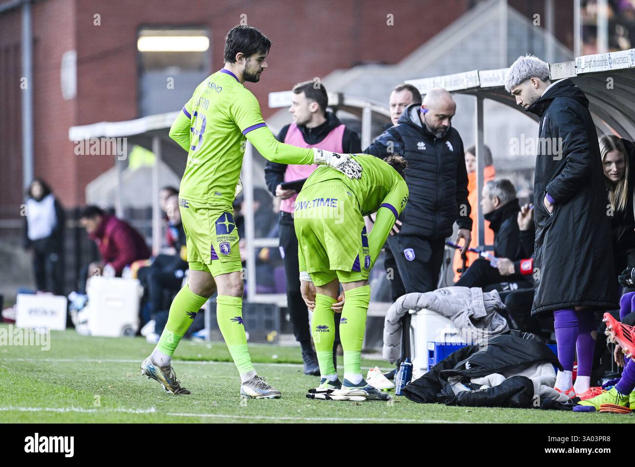 Beerschot's goalkeeper Nick Shinton leaves the field after receiving a ...