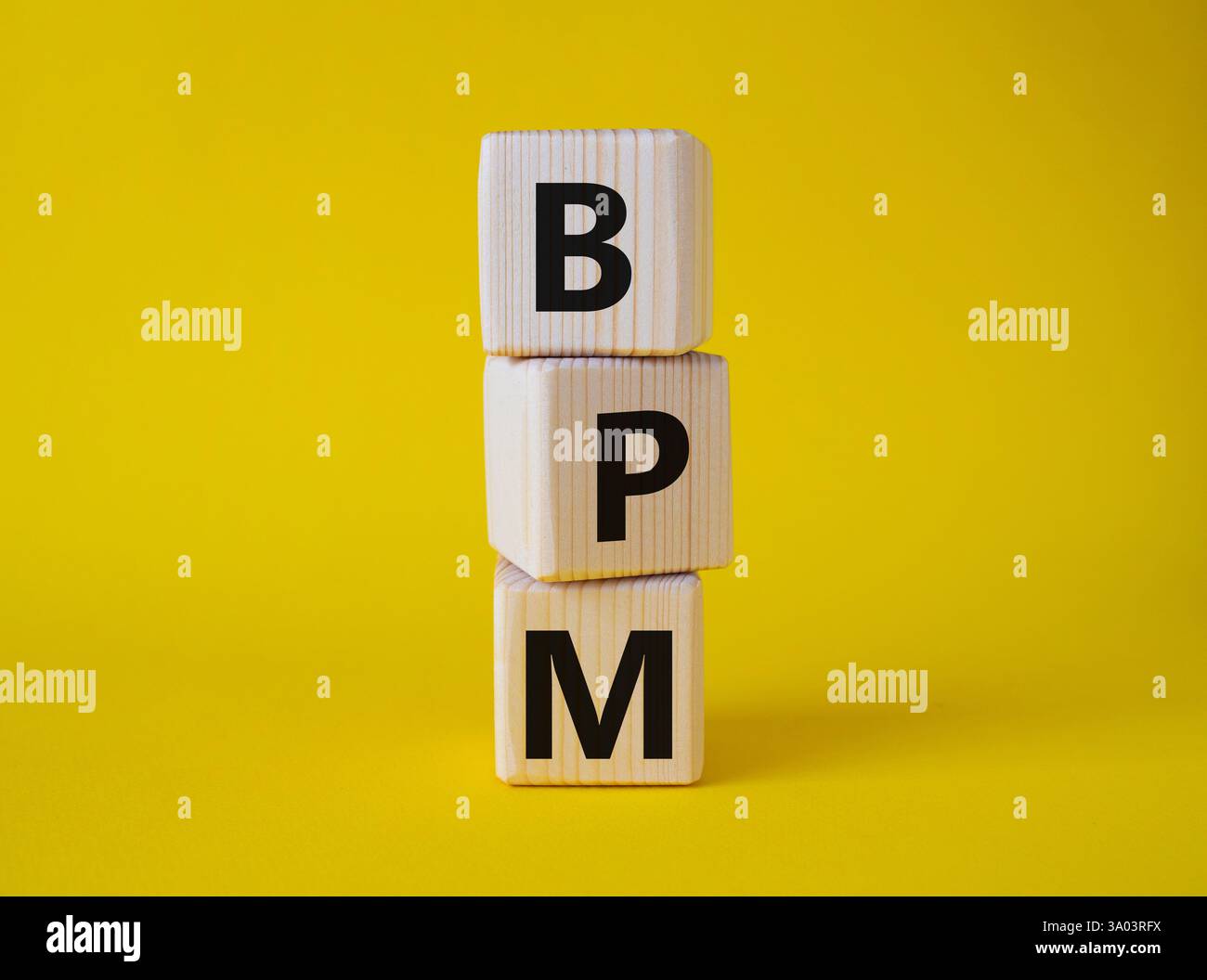 BPM - Business Process Management symbol. Wooden cubes with words BPM ...