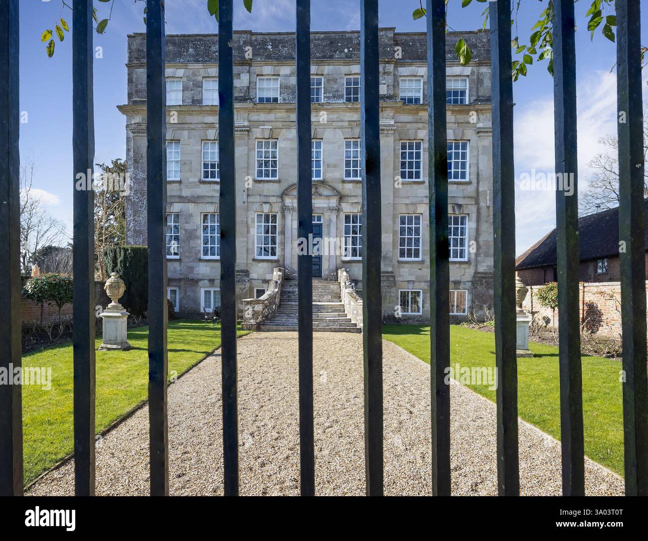 Myles Place seen through the metal railings of the entrance gate, a ...