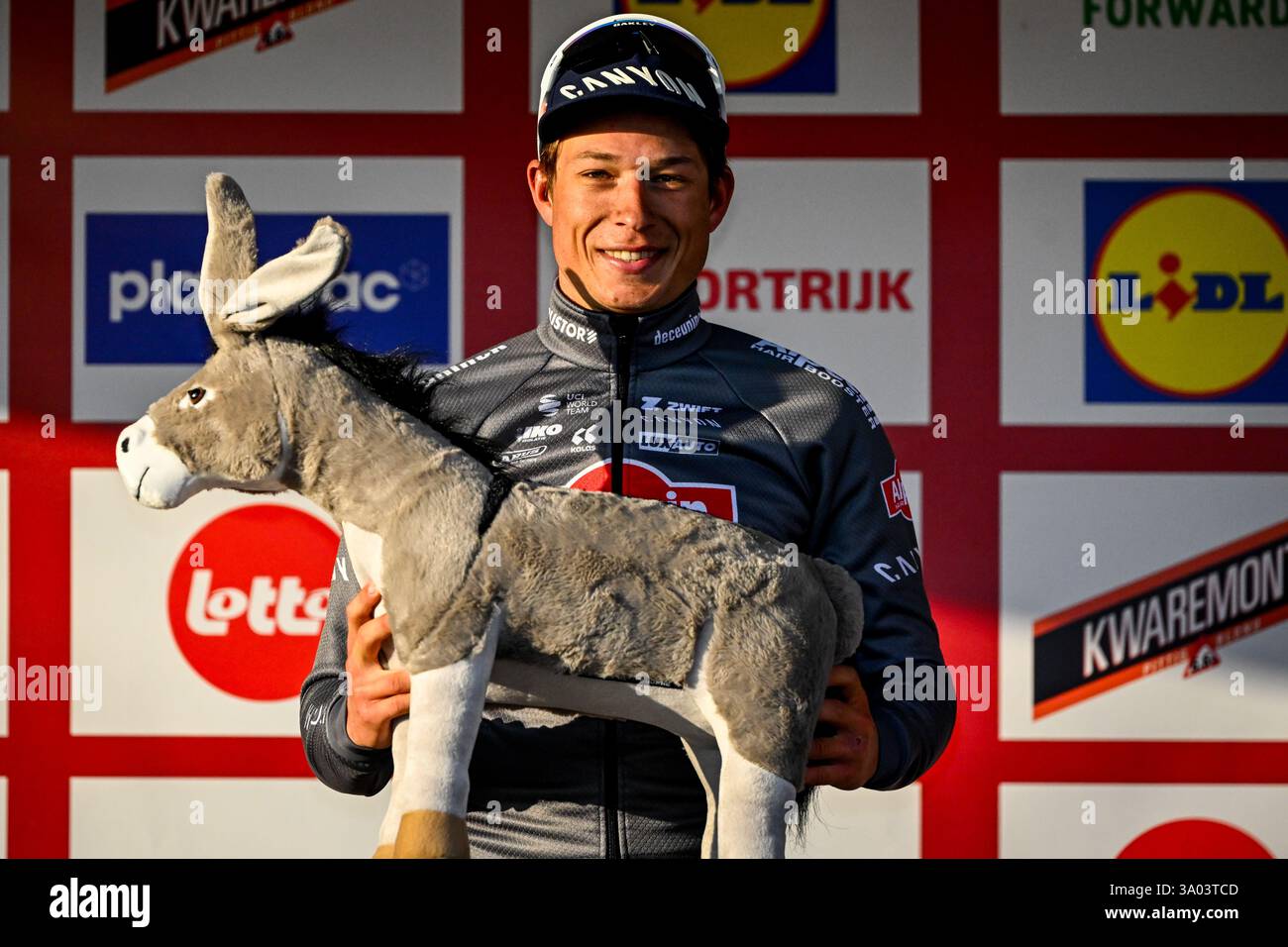 Belgian Jasper Philipsen of Alpecin-Deceuninck celebrates on the podium ...