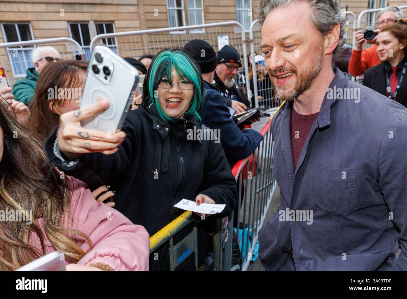 James McAvoy having a selfie taken with fans as he arrives at the ...