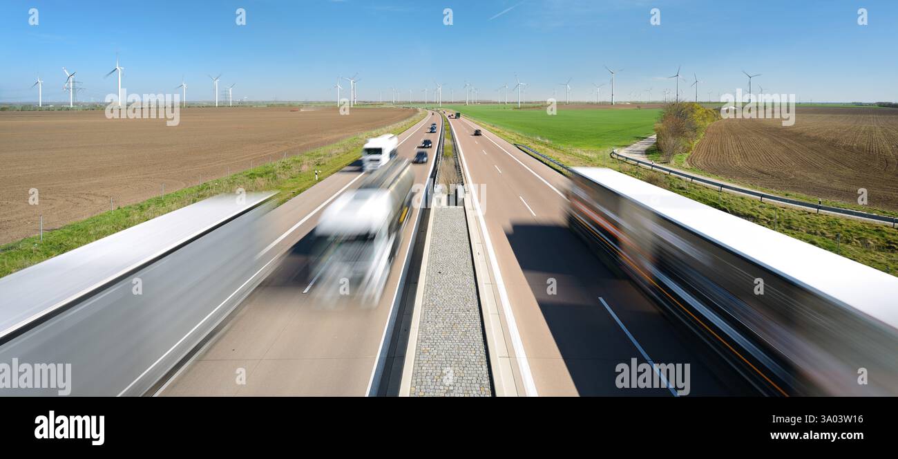 Motorway A38 near Querfurt, trucks and cars in motion blur, wind ...
