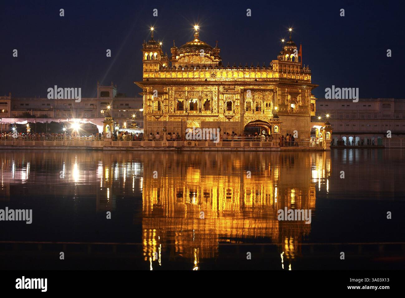 Glow of Harmandir Sahib or Darbar Sahib or Golden temple reflection in lake in Amritsar, Punjab ...