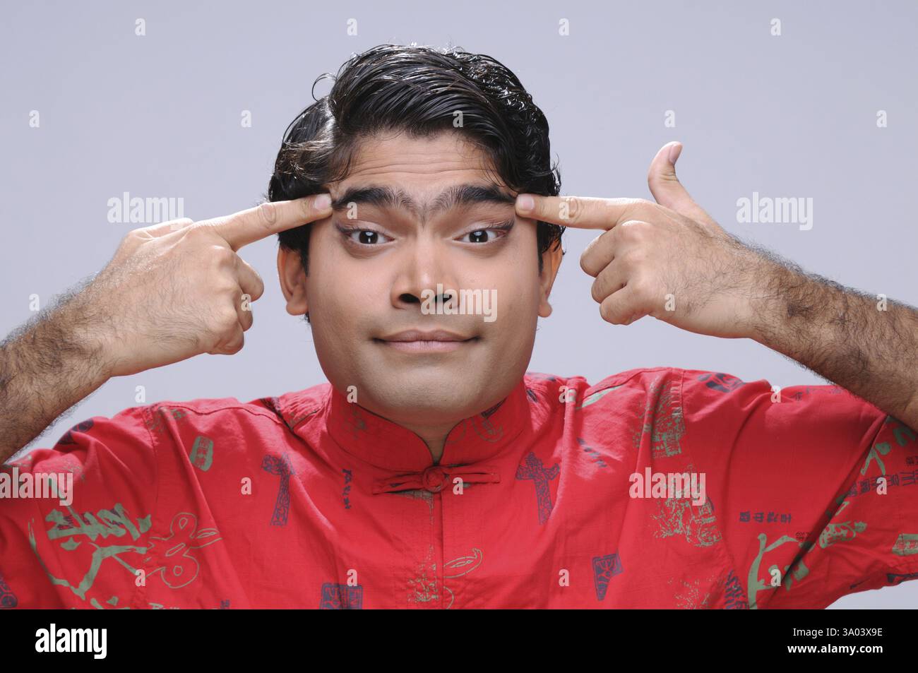 Man touching eyebrows MR#719F Stock Photo - Alamy