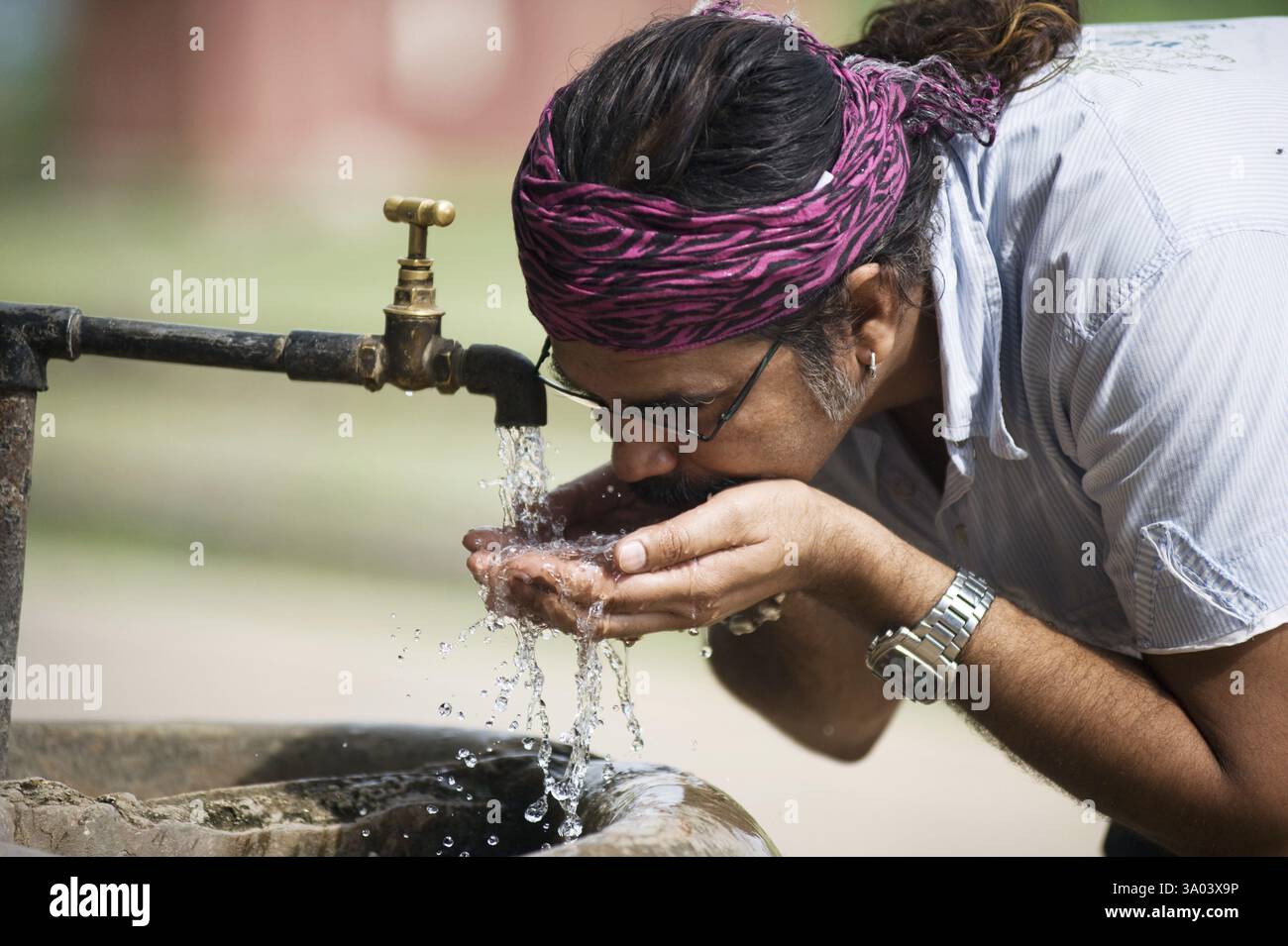 Man drink water tap hi-res stock photography and images - Alamy
