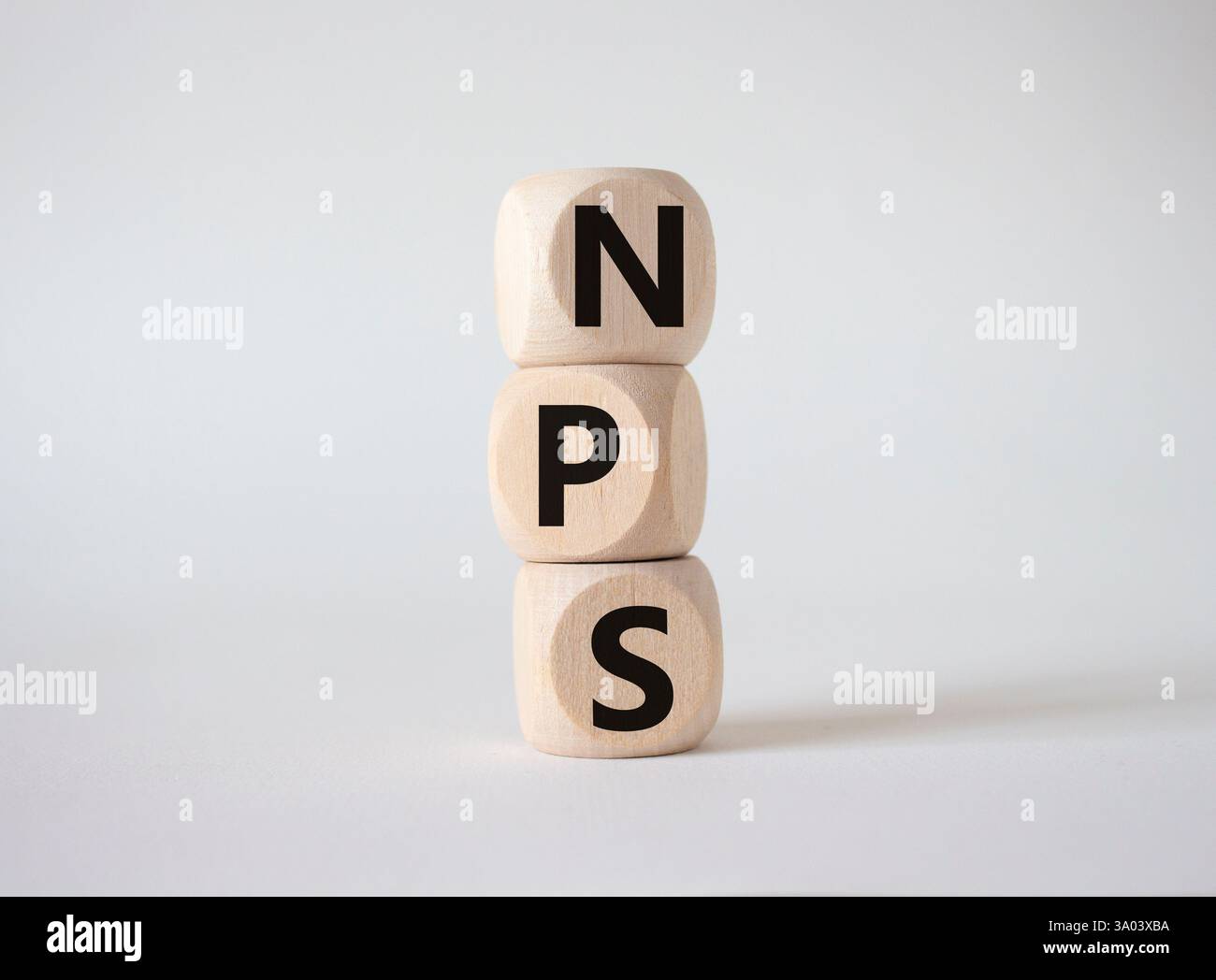 NPS - Net Promoter Score symbol. Wooden cubes with words NPS. Beautiful ...