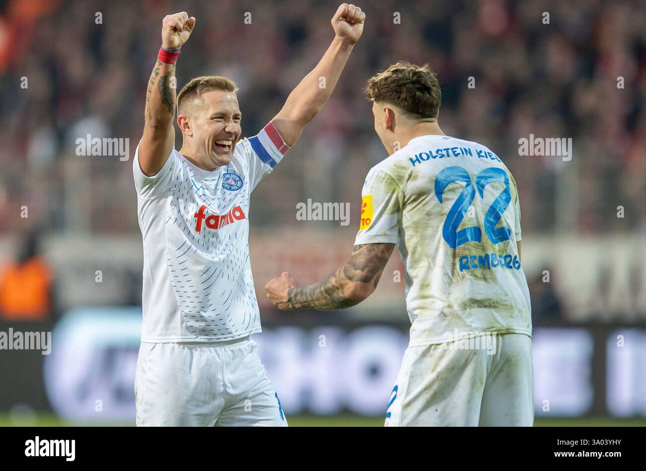 Holstein Kiel's Lewis Holtby, left, and Nicolai Remberg celebrate after ...