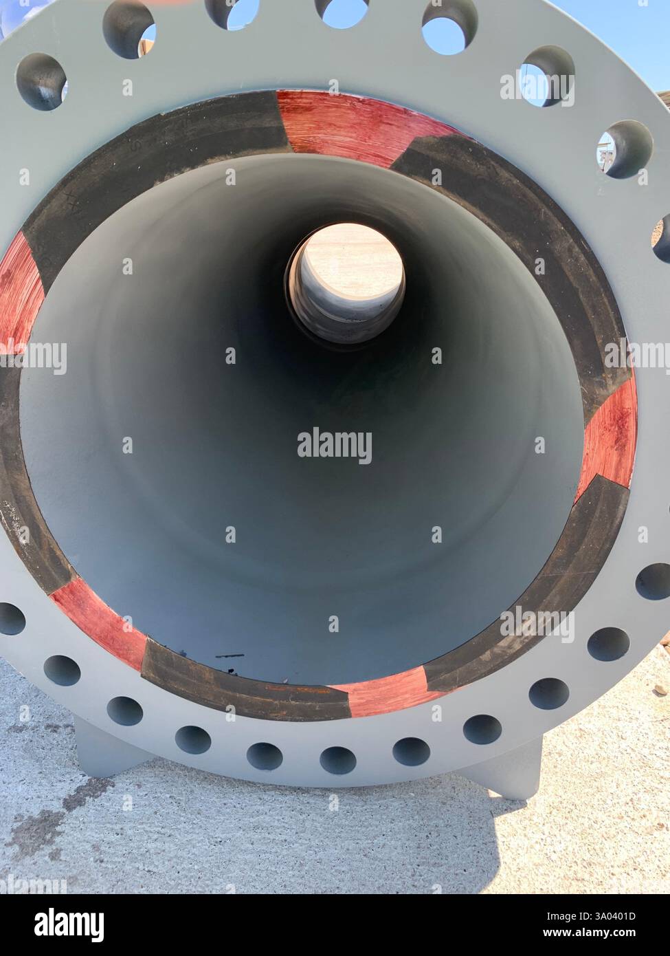 A close-up view of a large industrial Venturi tube with a flanged end ...