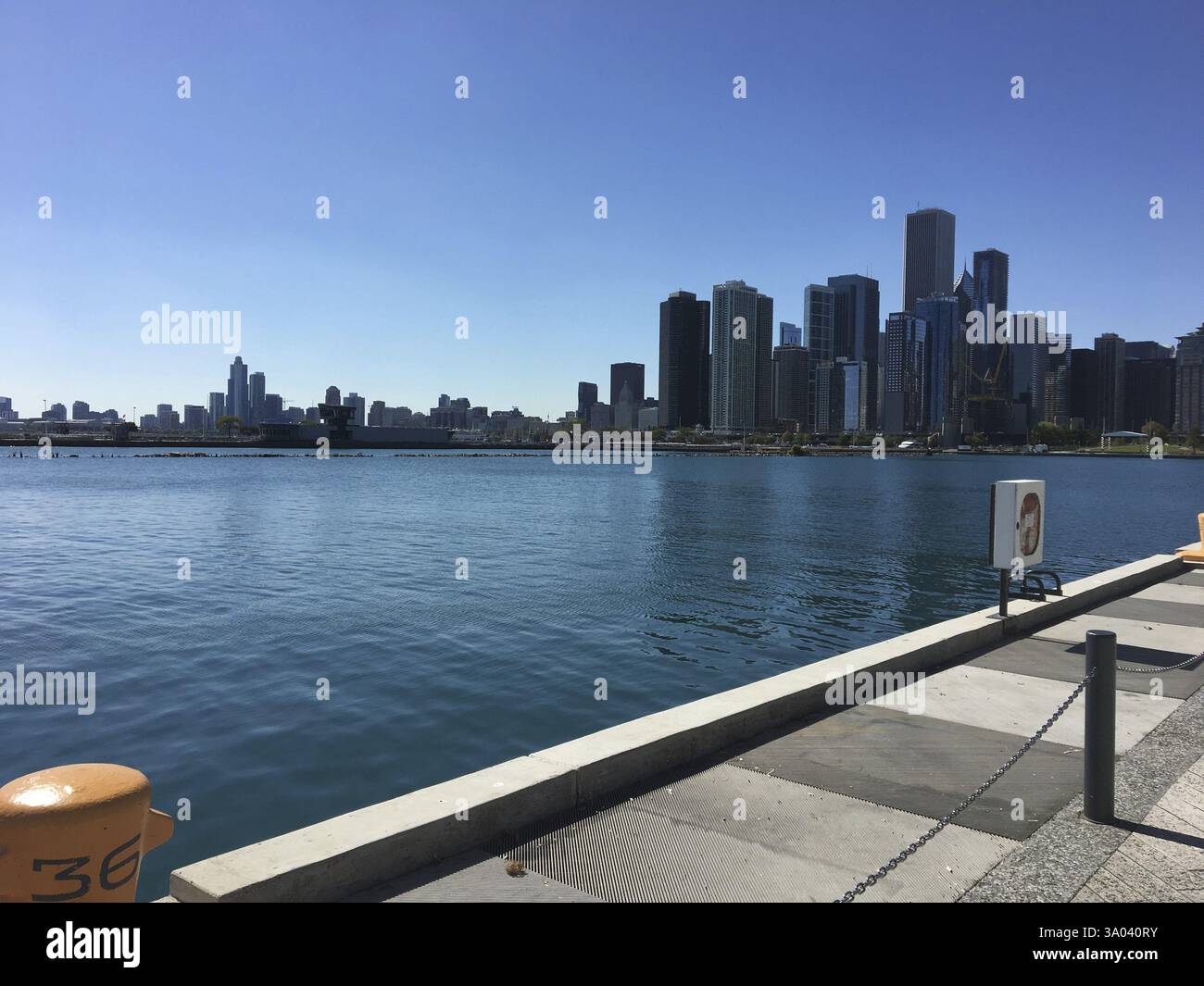 Panorama of waterfront skyline with calm lake and blue sky, chicago ...