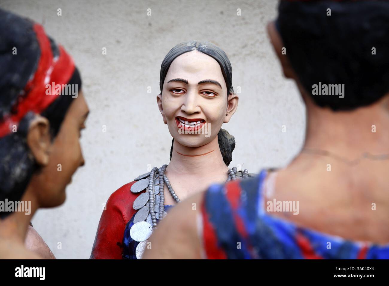 Statues of male and females showing North east region people and their traditional clothing ...