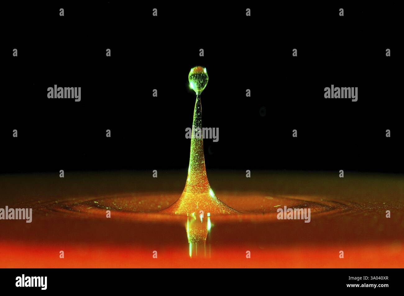 Colourful water drop Stock Photo - Alamy