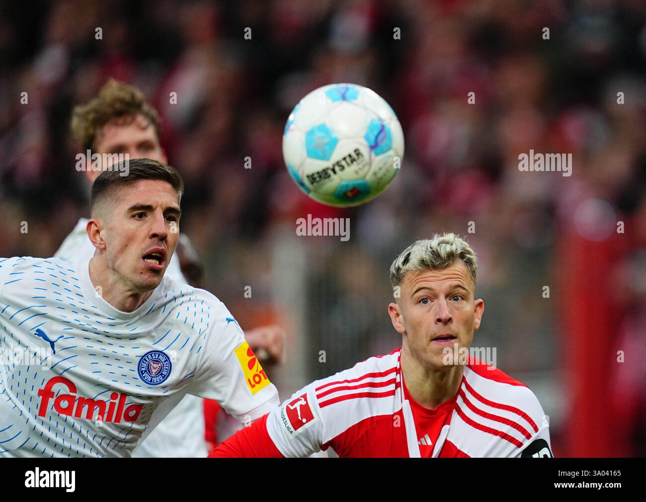 March 02 2025: Marko Ivezic of Holstein Kiel and Tim Skarke of 1.FC ...
