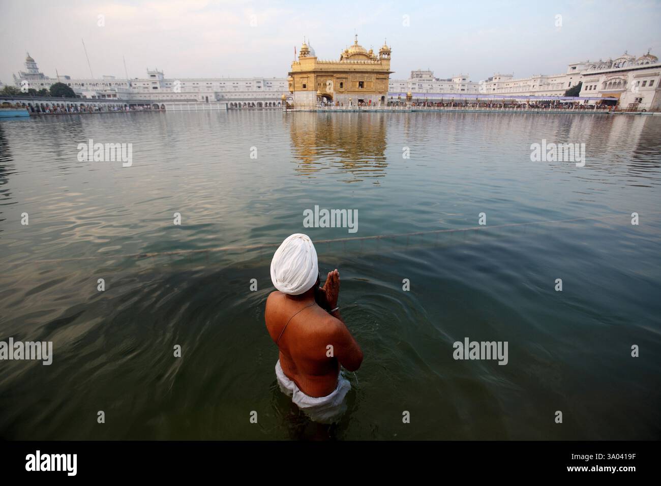 Sikh offering his prayers to Harmandir Sahib or Darbar Sahib or Golden ...