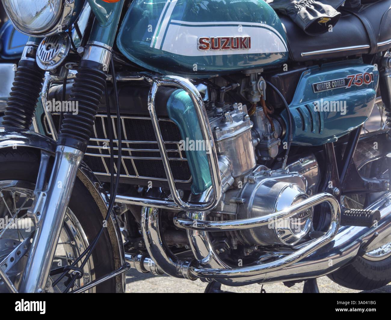 Retro Suzuki motorbike with water-cooled engine and turquoise-coloured ...