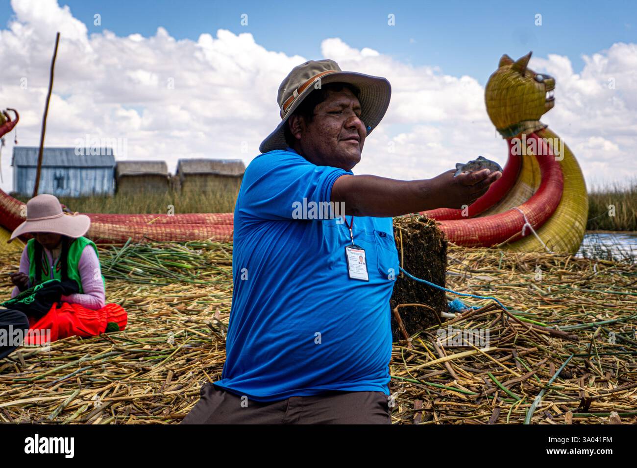 Indigenous Guide Showing a Fish from Lake Titicaca on the Uros Floating ...
