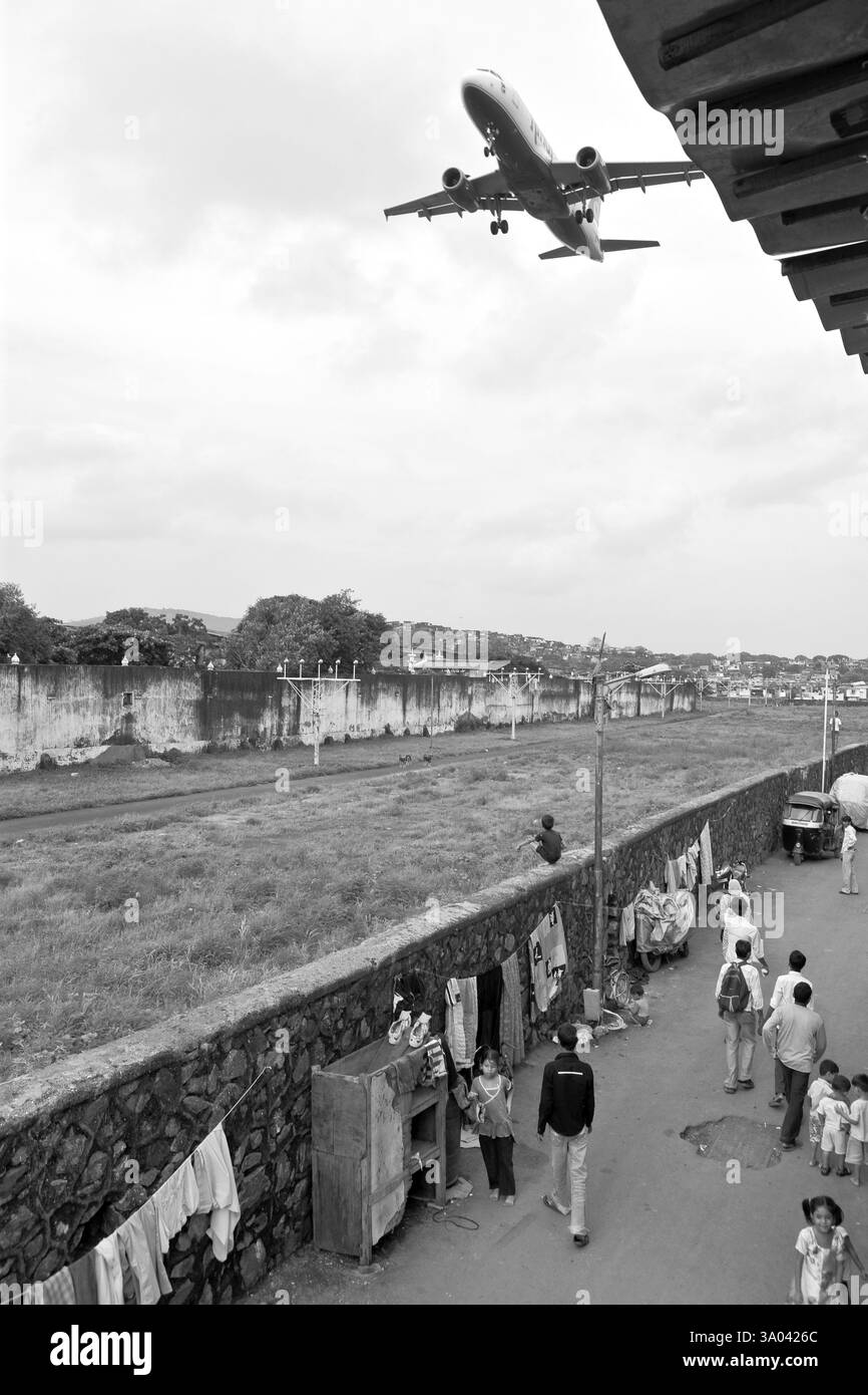 Aeroplane flying over kamani indira nagar and kaju pada slum, Bombay ...