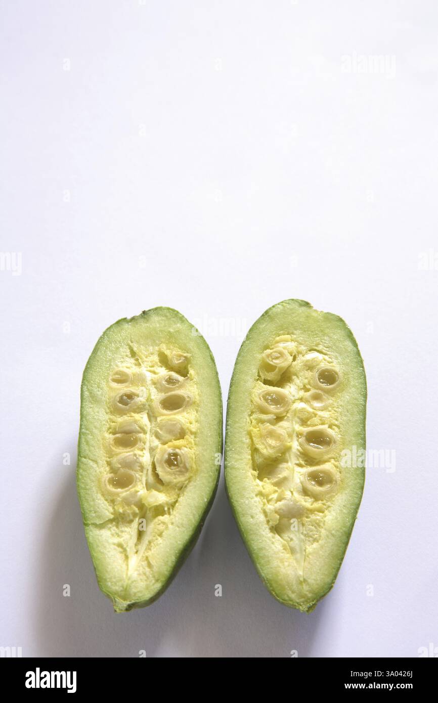 Vegetable, half striped pear gourds parwal on white background Stock ...