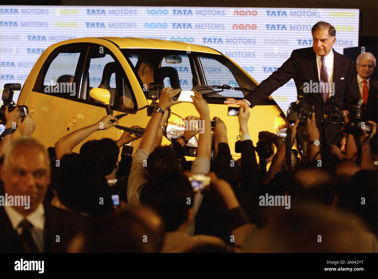Ratan Tata Chairman Tata Group and Tata Motors with nano car and press ...