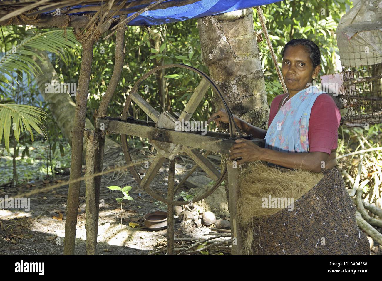 Keralite woman making coir rope in cottage, traditional method, Kerala ...
