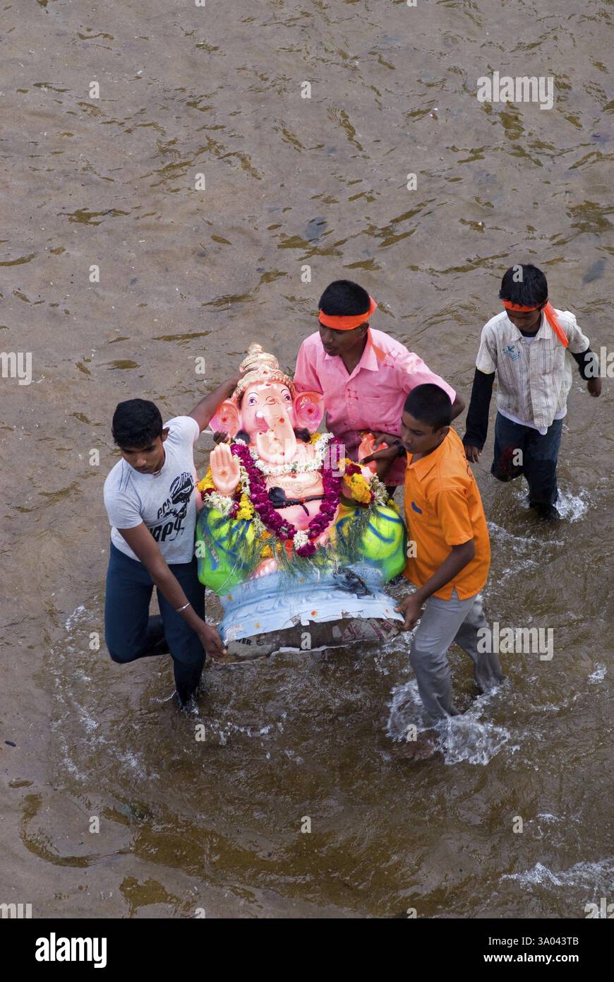 People carrying idol of lord ganesh for immersion in river bhavani on ...