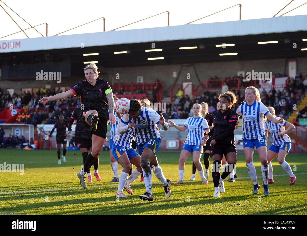 Brighton and Hove Albion's Madison Haley heads the ball clear under ...