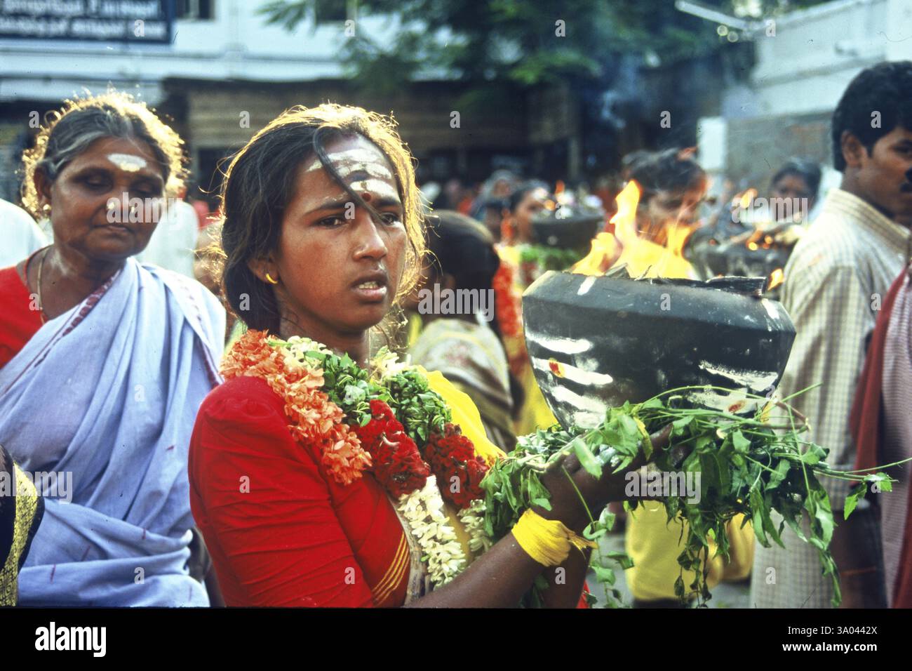 Devotee holding firepot in Mariamman Festival, Coimbatore, Tamil Nadu ...