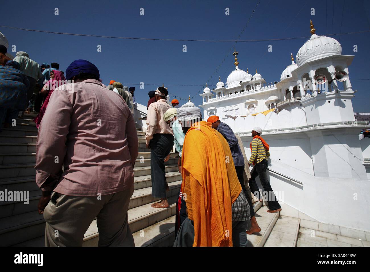 Devotees climbing stairs of Gurudwara of Anandpur Sahib during Hola Mohalla festival in Rupnagar ...