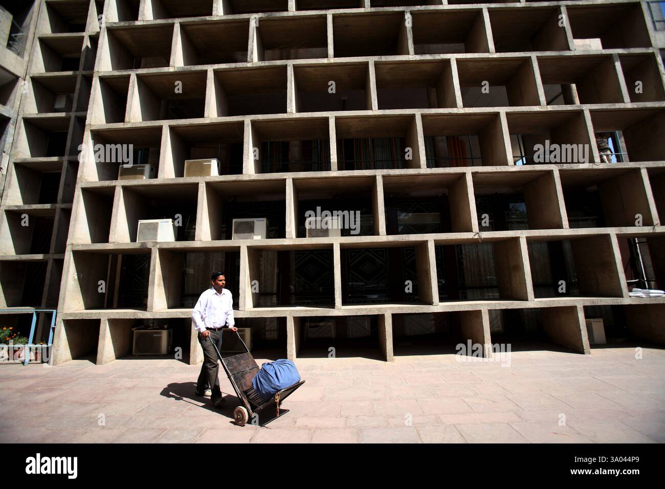 Court employee moving with papers on hand trolley at high court ...