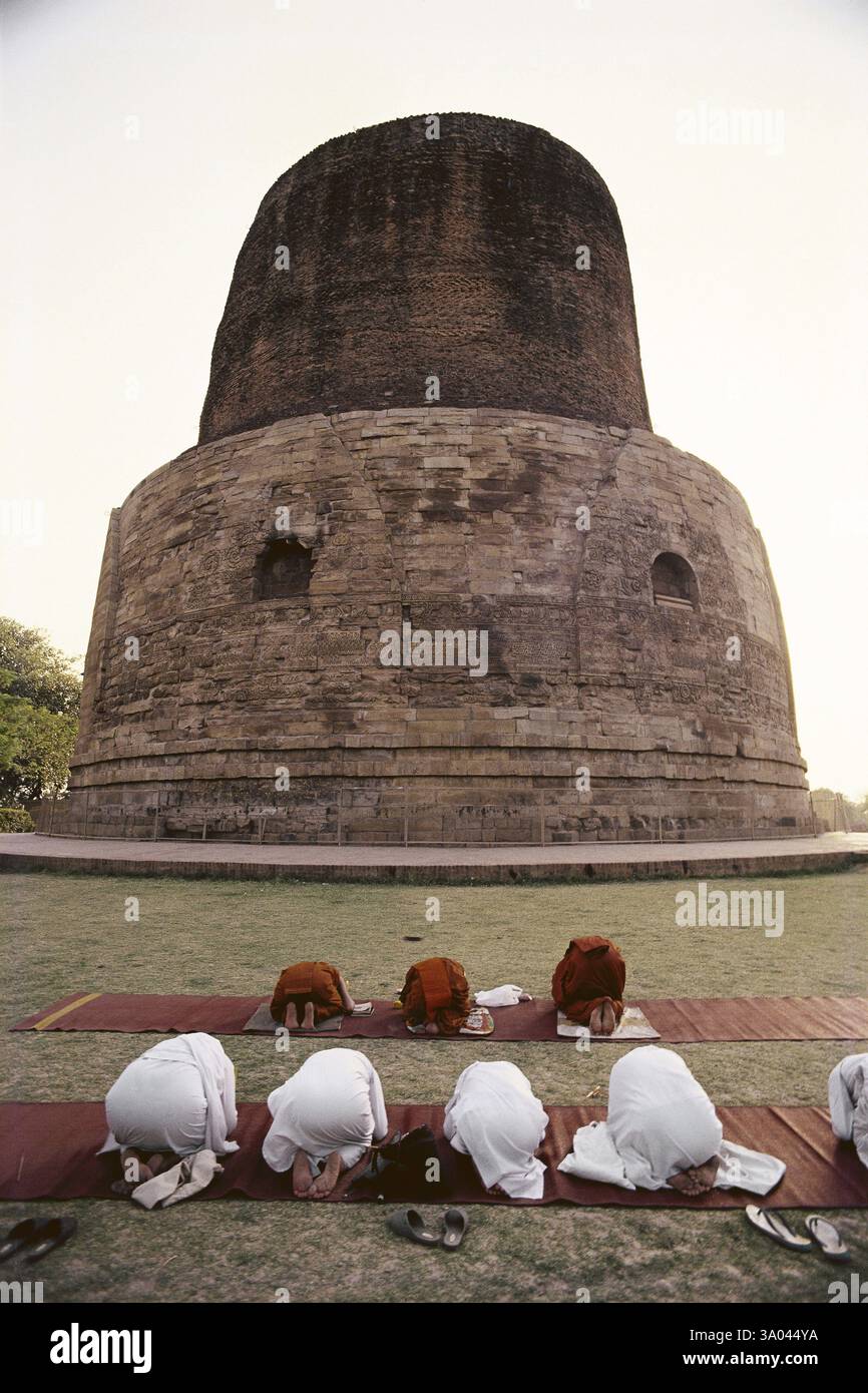 Buddhist monks bowing in prayer, Sarnath, Varanasi, Uttar Pradesh ...
