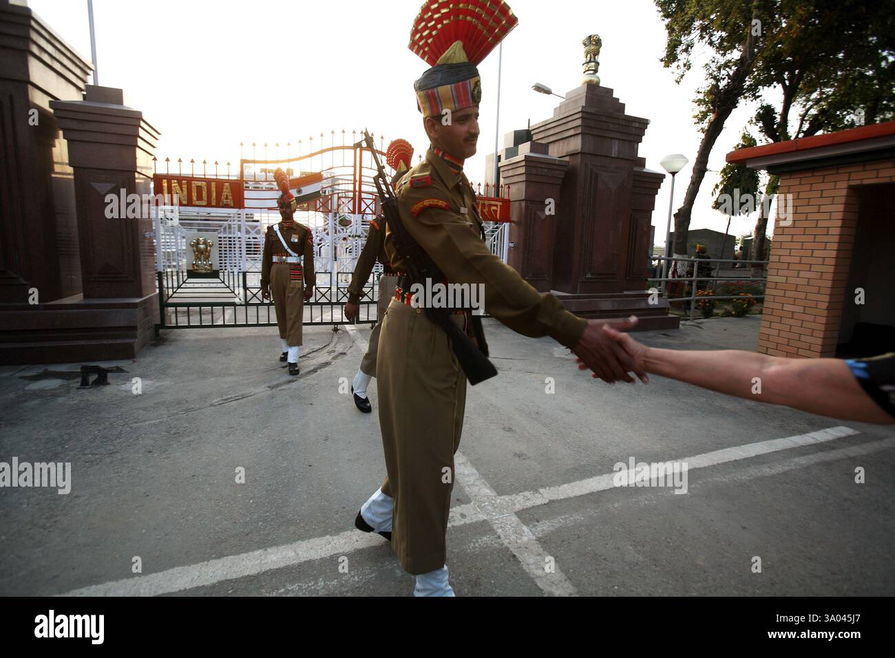 Indian border security force solider shaking hand with people during ...