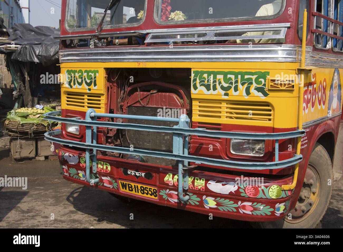 Front panel of local bus written Howrah in Bangla Bengali script ...