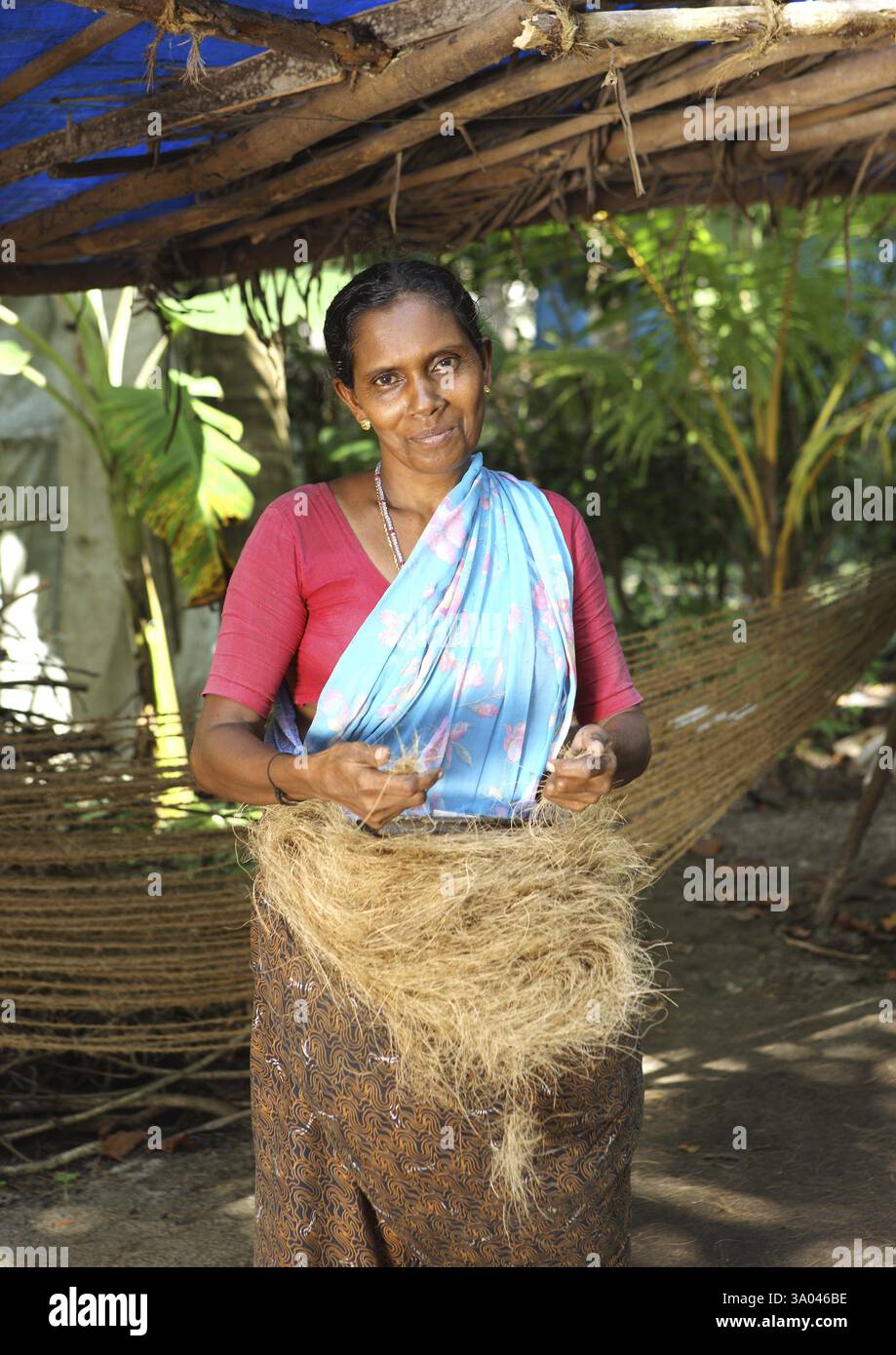 Keralite woman making coir rope in cottage, traditional method, Kerala ...