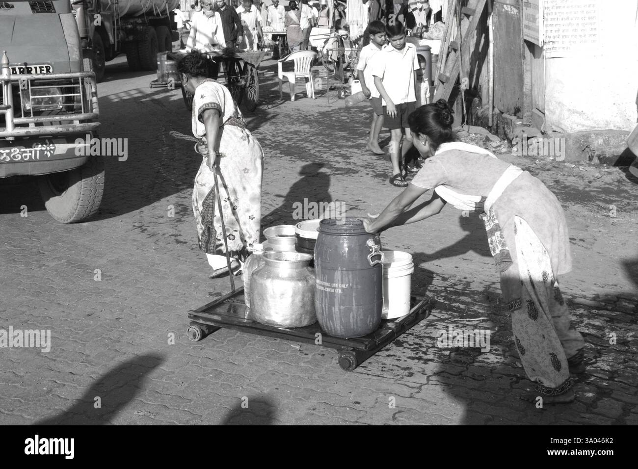 Women pushing water pots on cart, Ray Road, Bombay Mumbai, Maharashtra ...