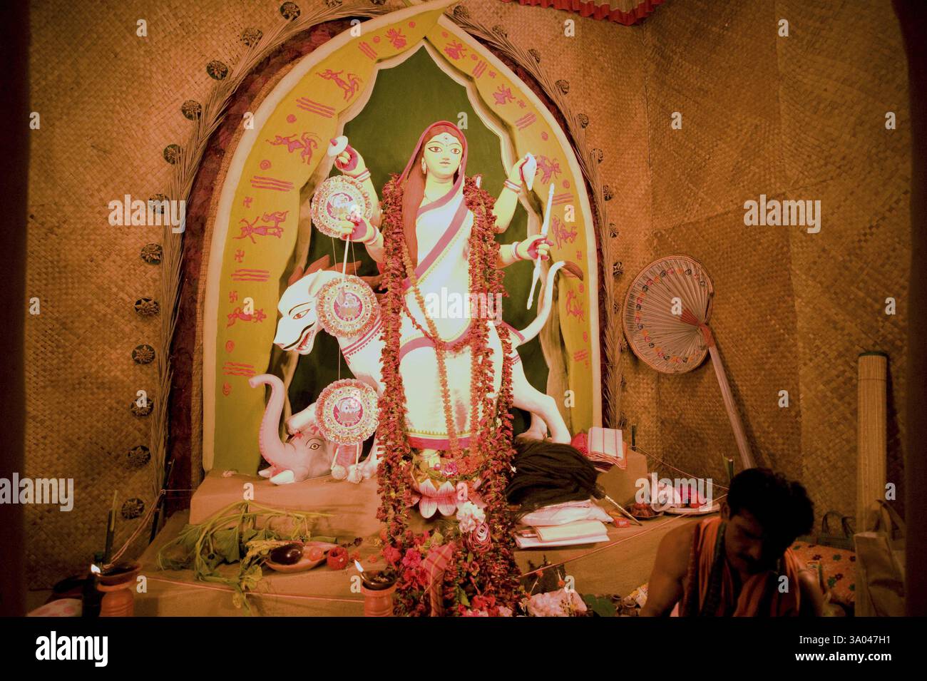 Mother goddess Durga in conventional Bengali sari and in midst of ...