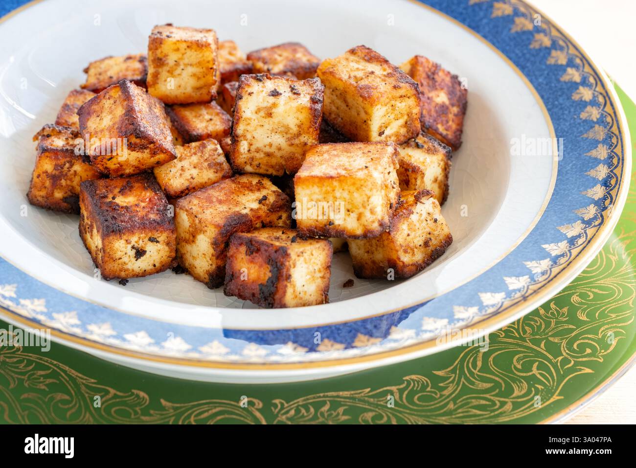 A bowl of pan fried cubed, British made Paneer soft cheese. The cheese ...