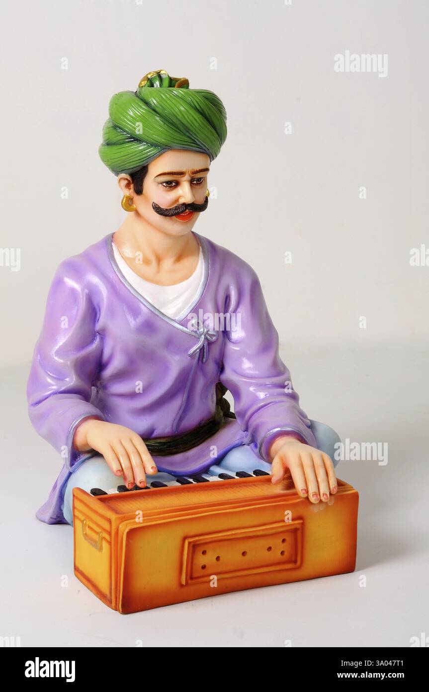 Clay figurine, statue of rajasthani musician playing harmonium Stock ...