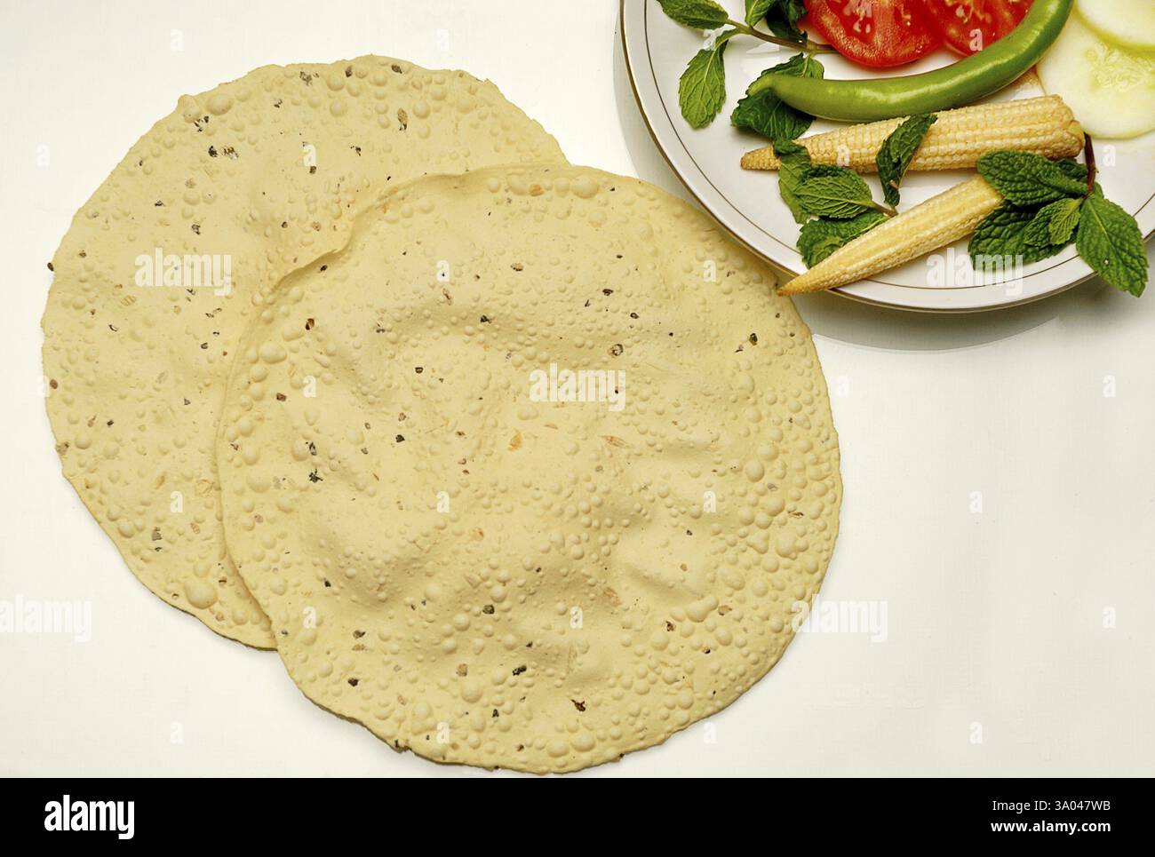 Snacks, namkeen papad and corn on white background, Jodhpur, Rajasthan ...