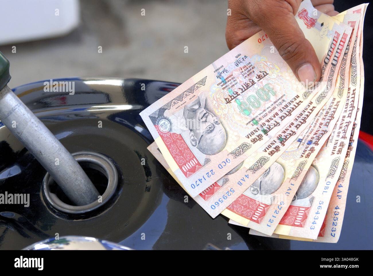 Hand showing currency of one thousand rupees MR#364 Stock Photo - Alamy